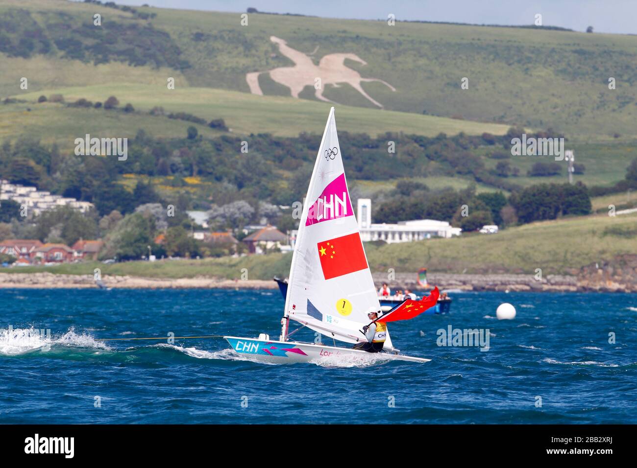China's Lijia Xu celebrates her victory in the Women's Laser Radial ...
