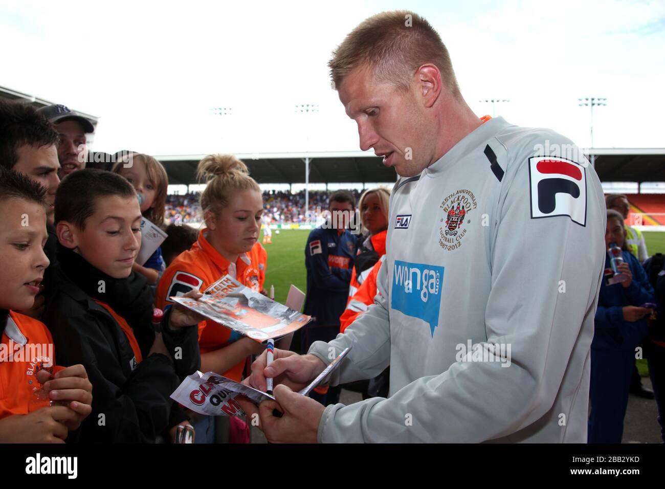 Blackpool's Keith Southern signs autographs for fans before the game ...