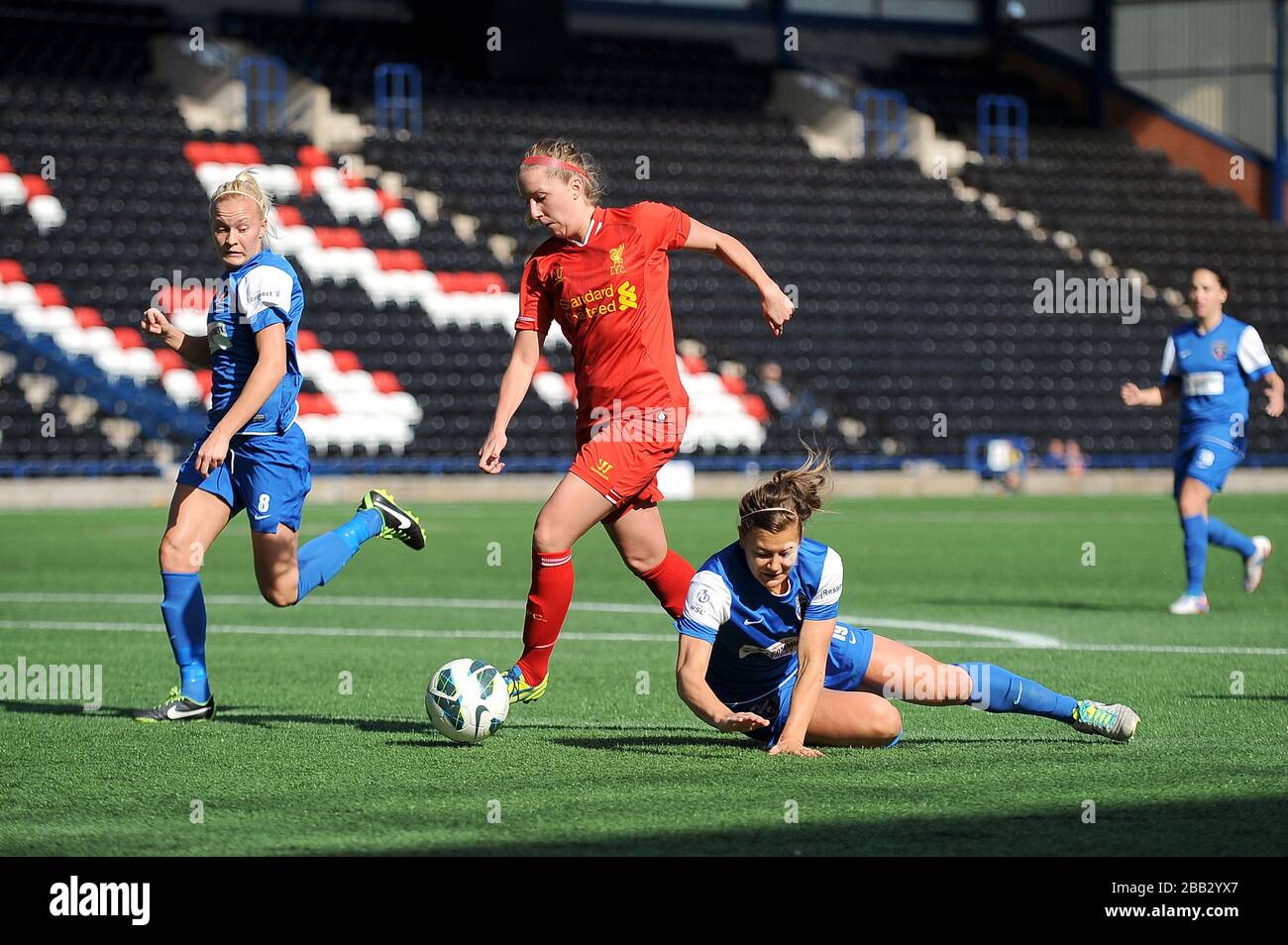 Liverpool's Louise Fors (centre) gets past Bristol Academy's Jemma Rose ...