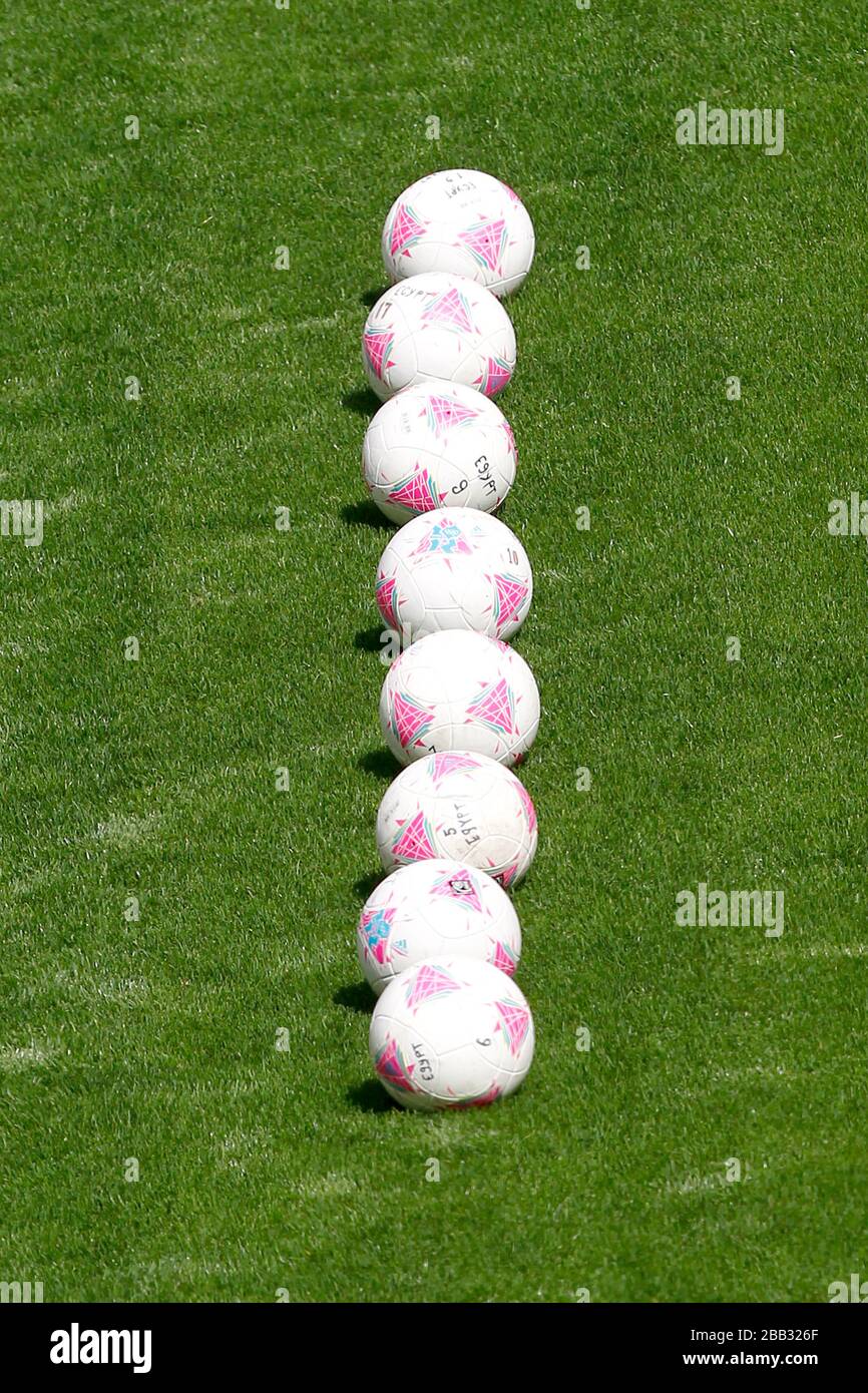 Match day balls lined up on the pitch Stock Photo - Alamy