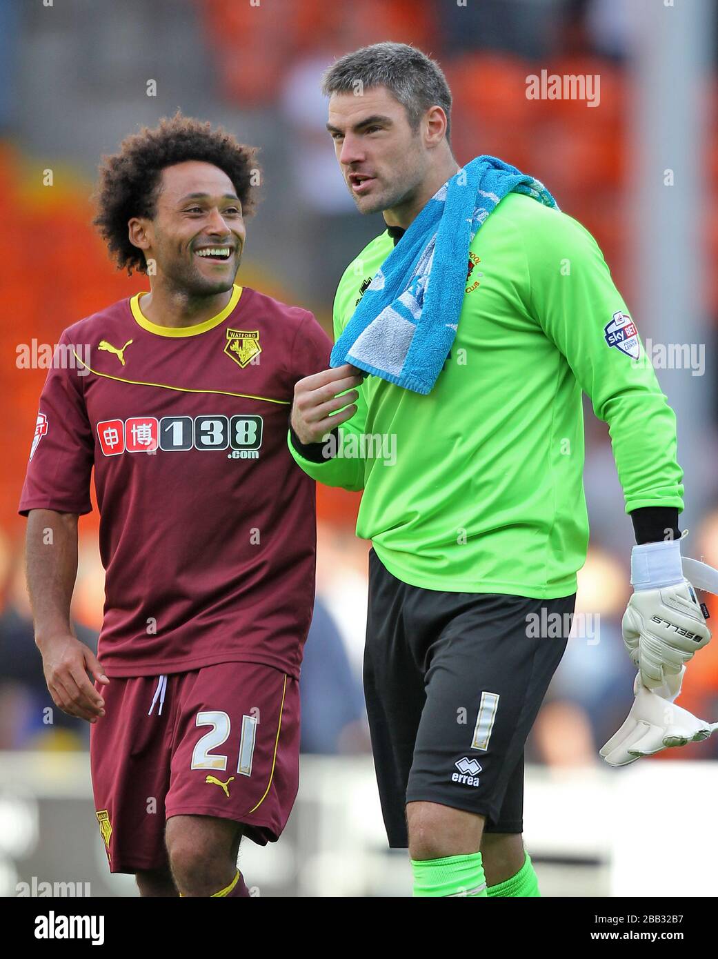 Watford's Ikechi Anya (left) and Blackpool goalkeeper Matthew Gilks ...