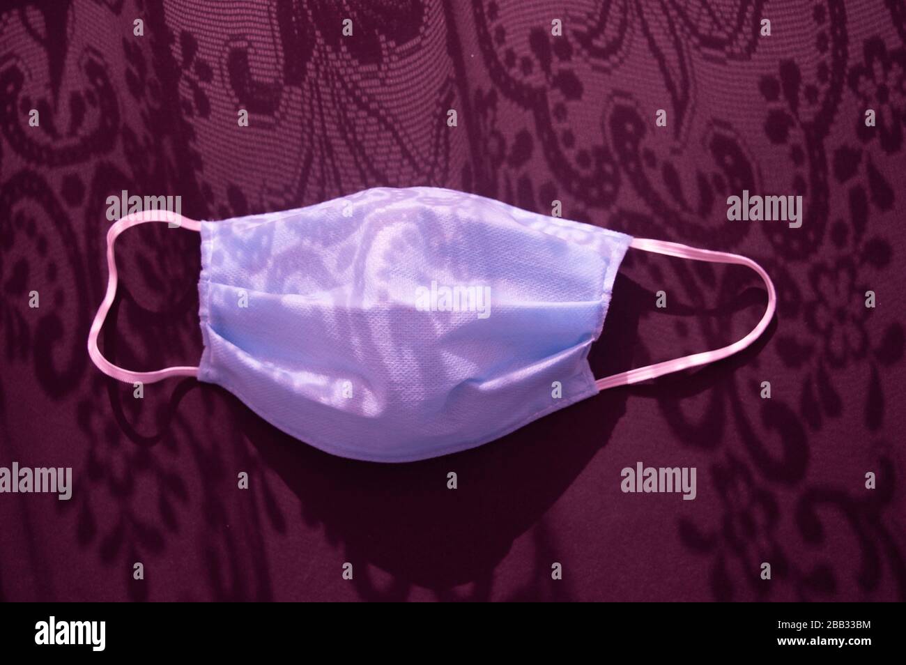 Medical mask againts virus covid-2019 in the sunlight with ornament ...