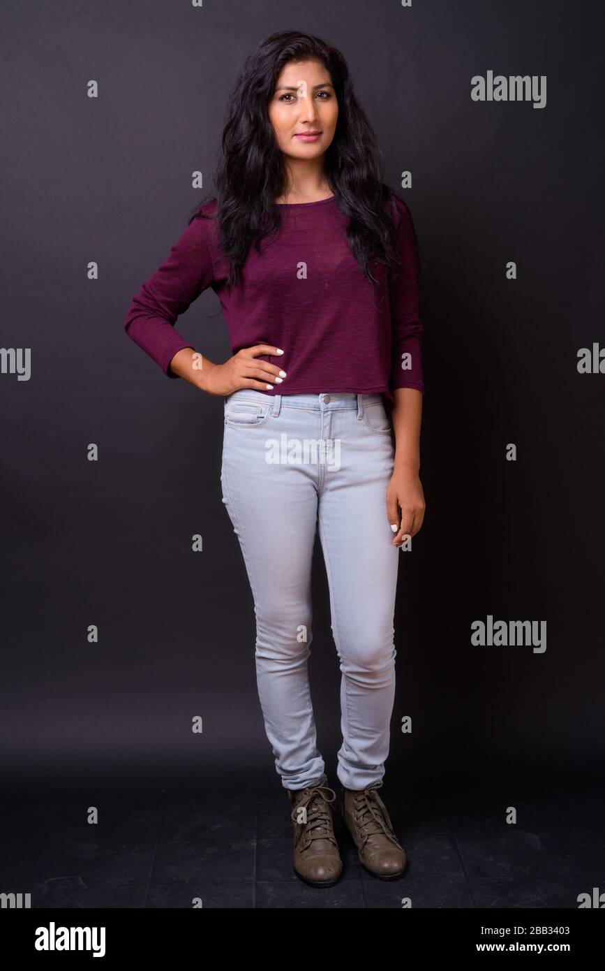 Full body shot of young beautiful Indian woman Stock Photo - Alamy