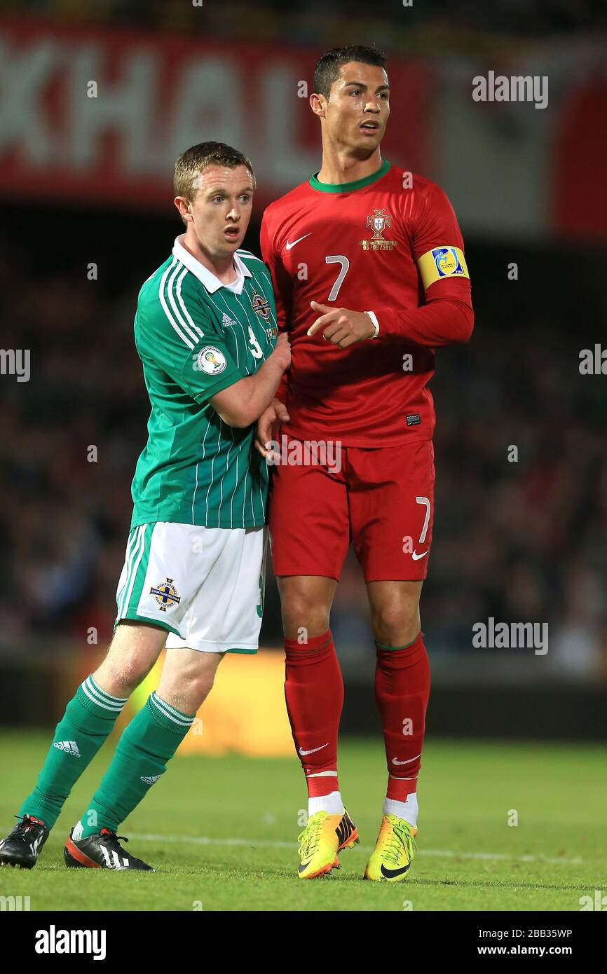 Northern Ireland's Shane Ferguson (left) with Portugal's Cristiano ...