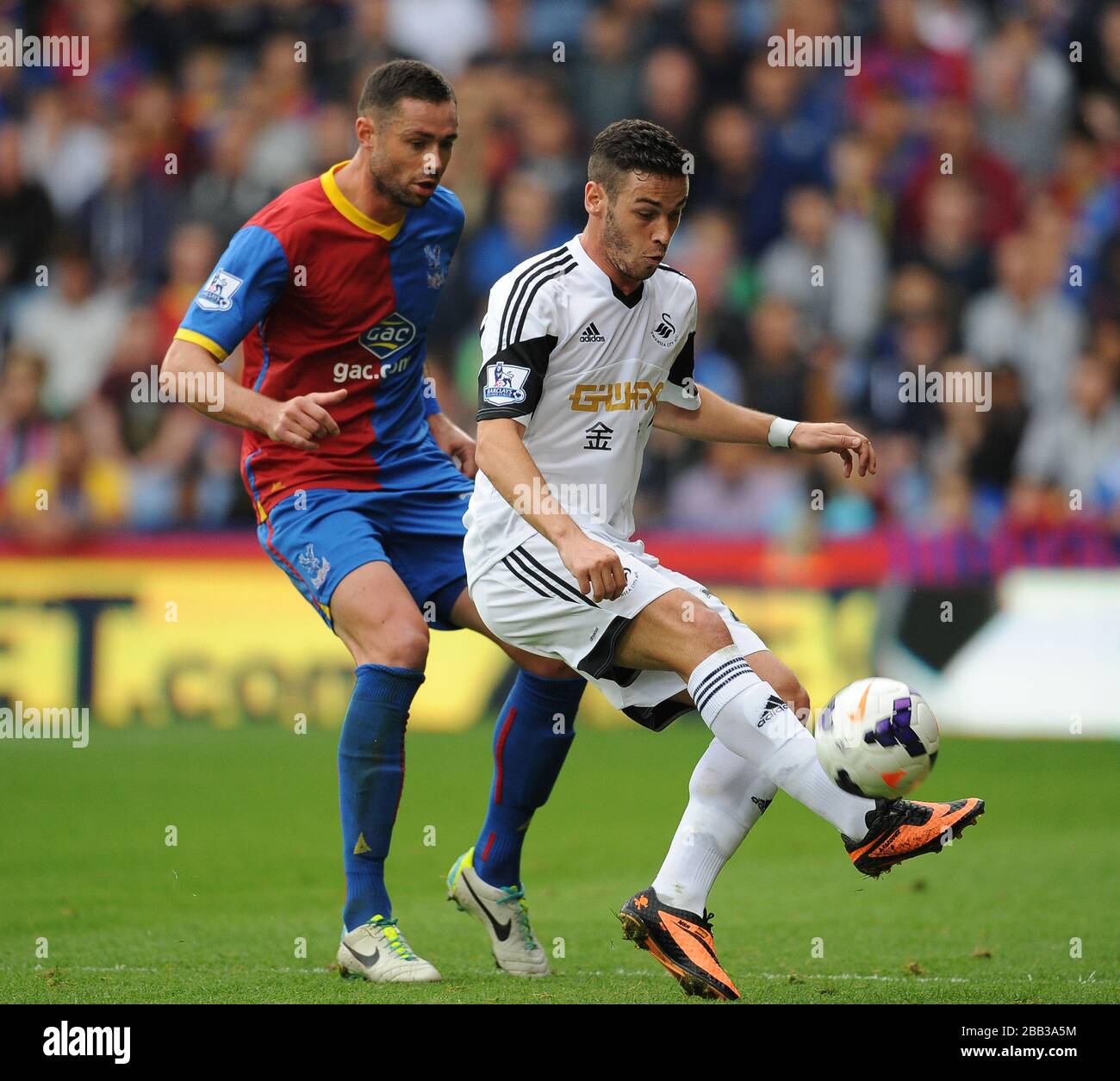 Crystal Palace's Damien Delaney (left) and Swansea City's Alvaro ...