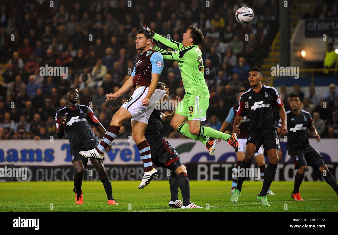 Burnley's Sam Vokes heads past Nottingham Forest keeper Dorus De Vries ...