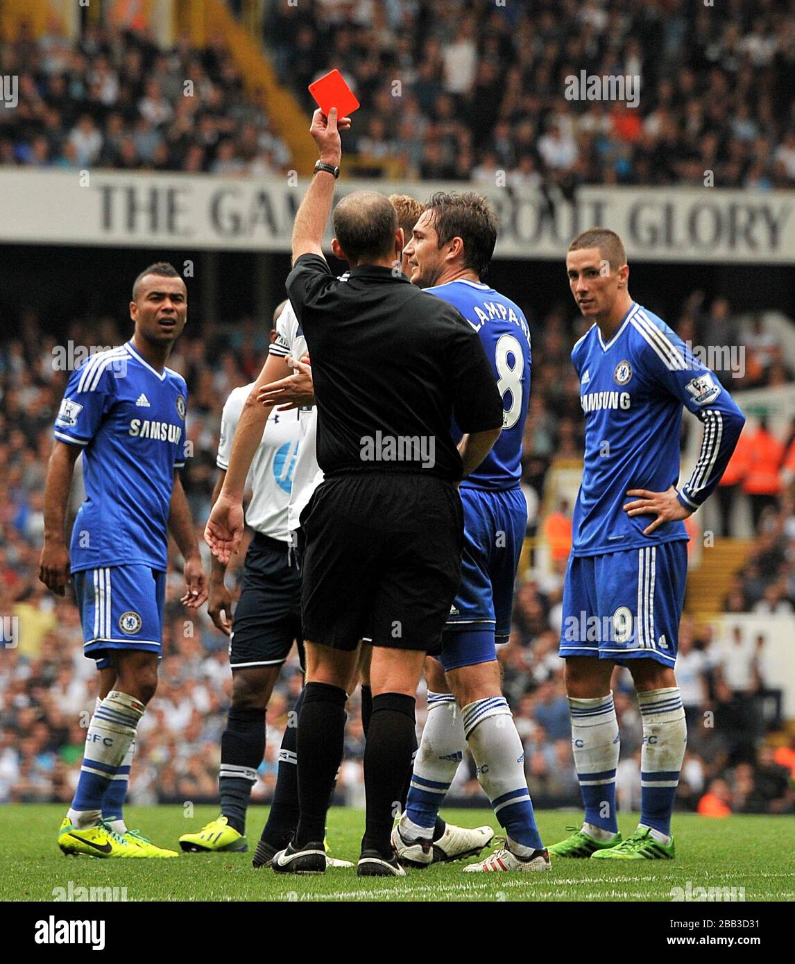Chelsea's Fernando Torres (right) is shown a red card by referee Mike ...