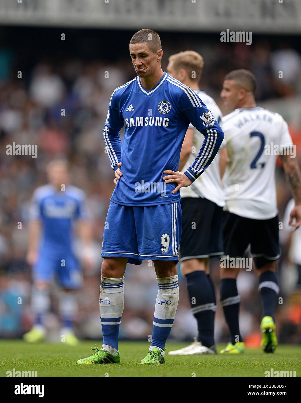 Chelsea's Fernando Torres stands dejected after being shown a red card ...