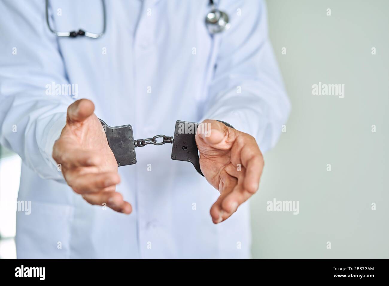 Doctor handcuffs hi-res stock photography and images - Alamy
