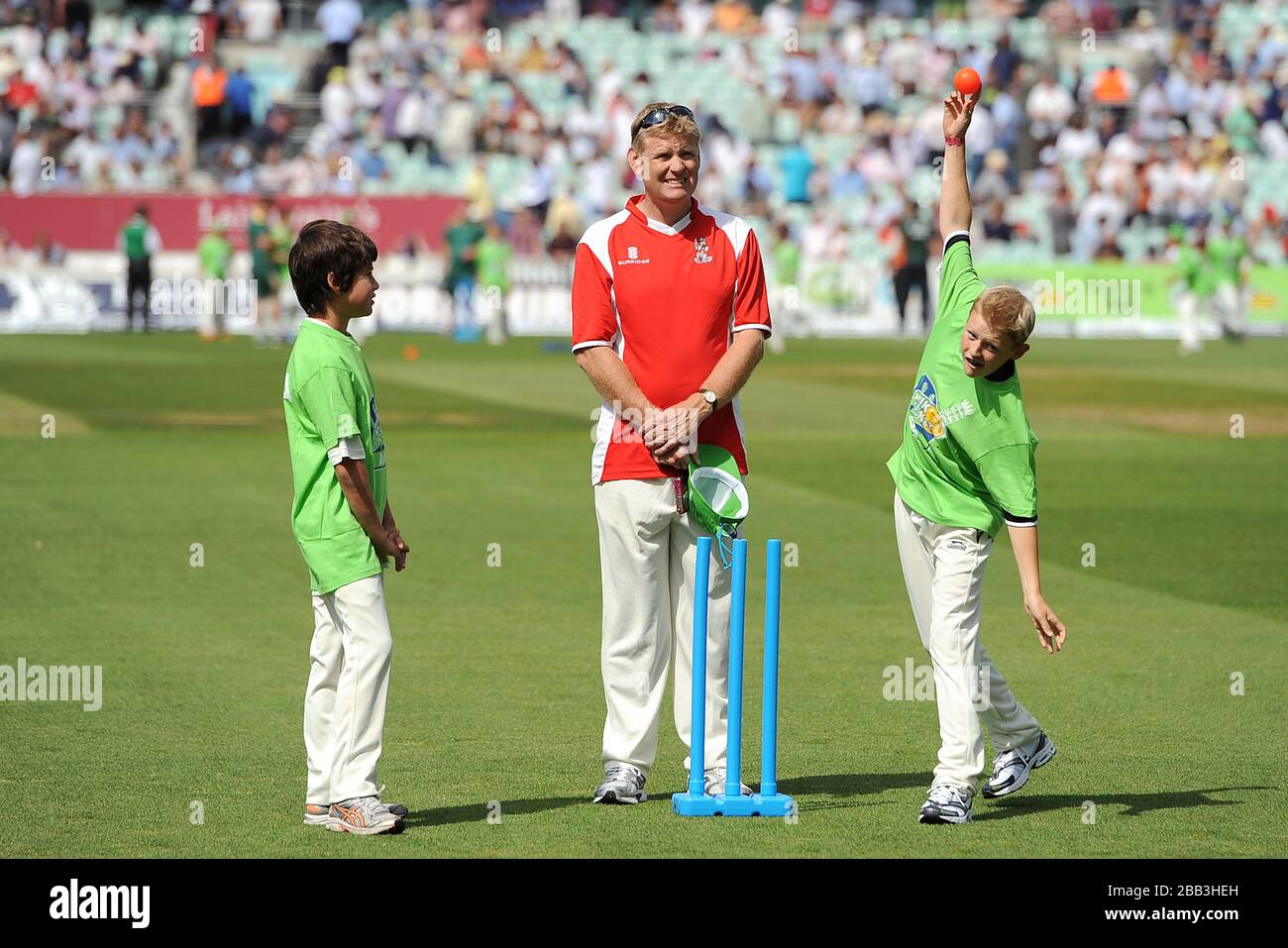 Children participate in the ASDA Kwik Cricket demonstration on the Kia ...