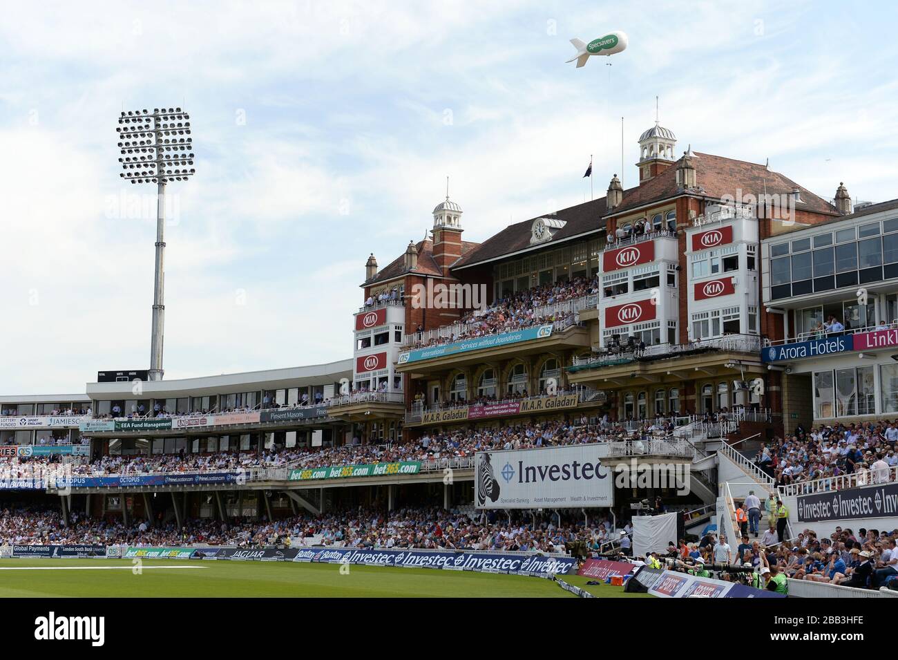 The crowds enjoy the action from The Pavilion at the Kia Oval Stock ...
