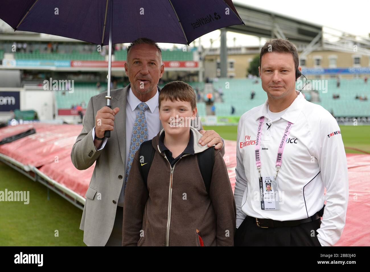 Former England cricketer Ian Botham (left) and ECB match official ...