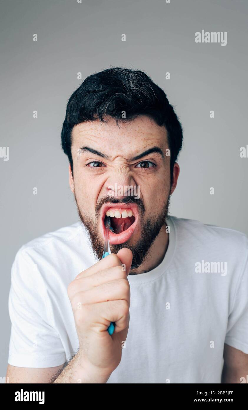 Young man isolated over background. Vertical picture of handsome ...
