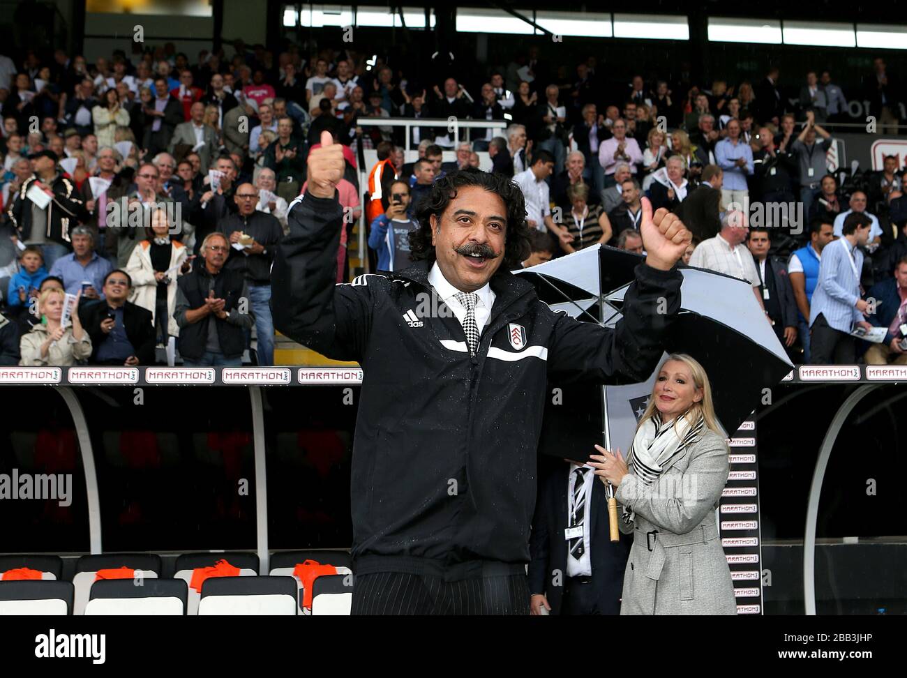 Fulham owner and Chairman Shahid Khan gives the thumbs up to the fans ...