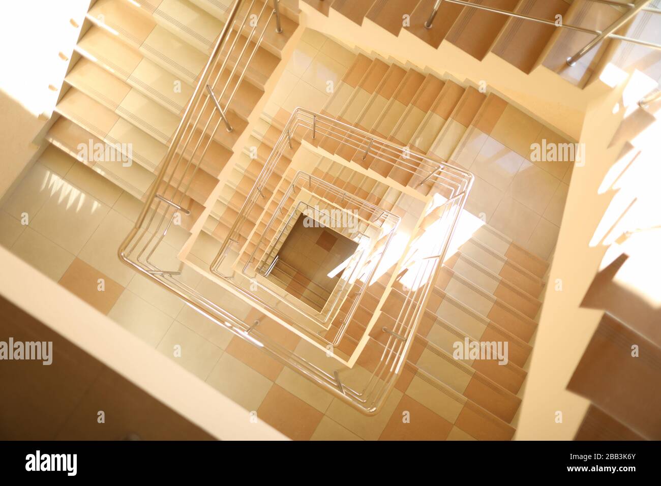 Staircase multi-storey building, tiled floor Stock Photo - Alamy