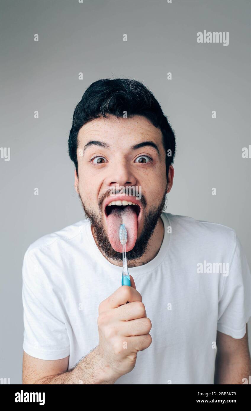 Young man isolated over background. Excited positive guy posing on ...