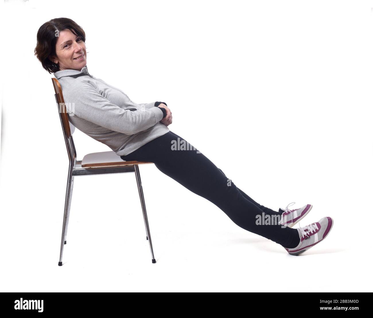 Woman lying on chair Cut Out Stock Images & Pictures - Alamy
