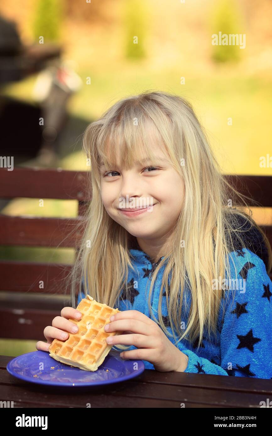 Breakfast in the form of crispy waffles outside Stock Photo - Alamy