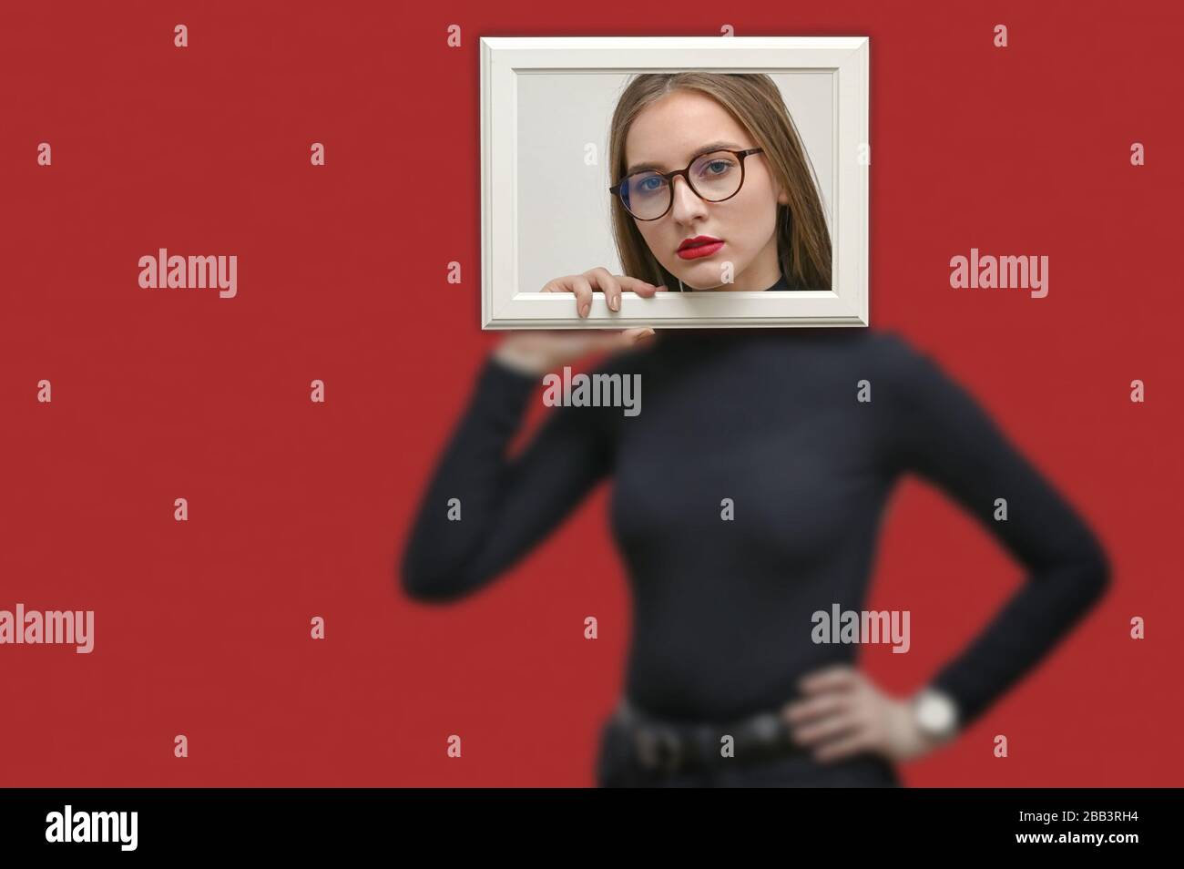 Girl looking through picture frame hi-res stock photography and images ...
