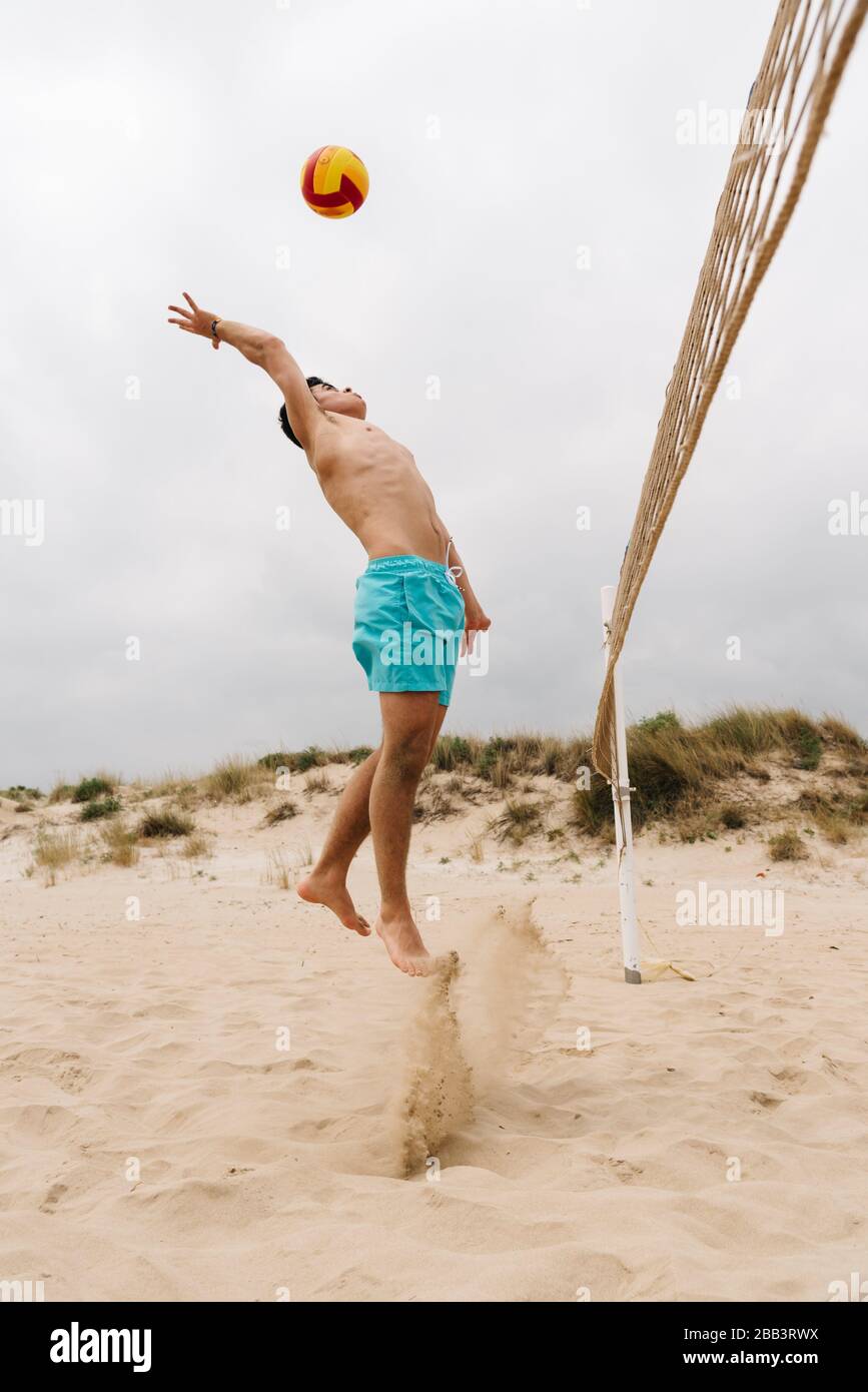 People Playing Volleyball On The Beach