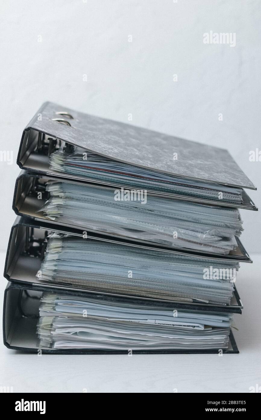 stack of files with documents against white background, business ...
