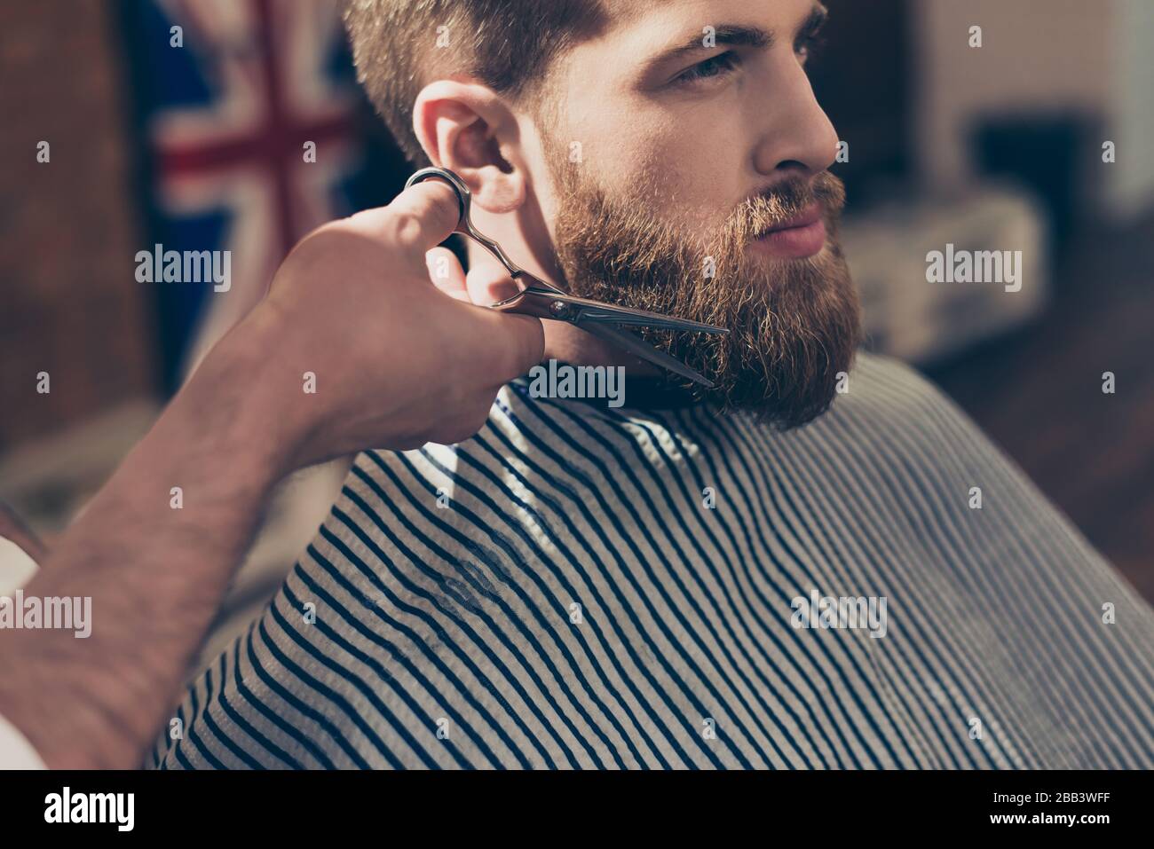 Close up cropped photo of a stylish red bearded guy in a striped cape ...