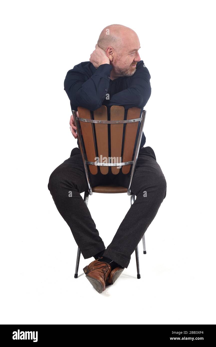 bald man sitting on white background, look side Stock Photo - Alamy