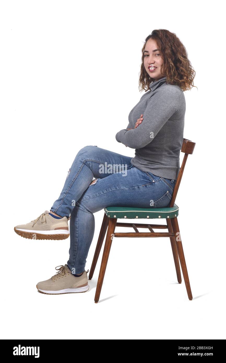 Woman sitting chair legs crossed Cut Out Stock Images & Pictures - Alamy