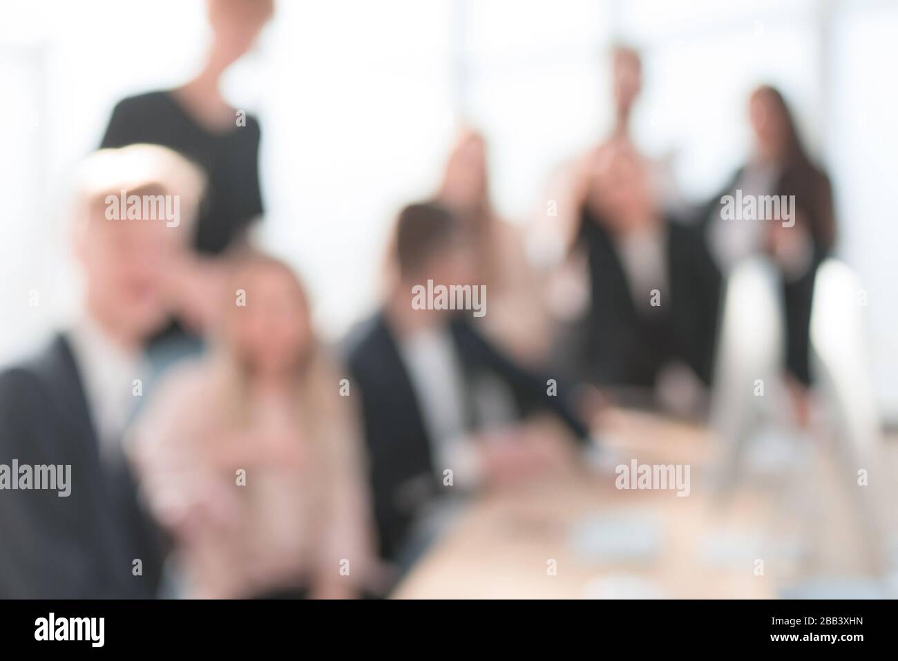background image of a business team sitting at a Desk Stock Photo - Alamy