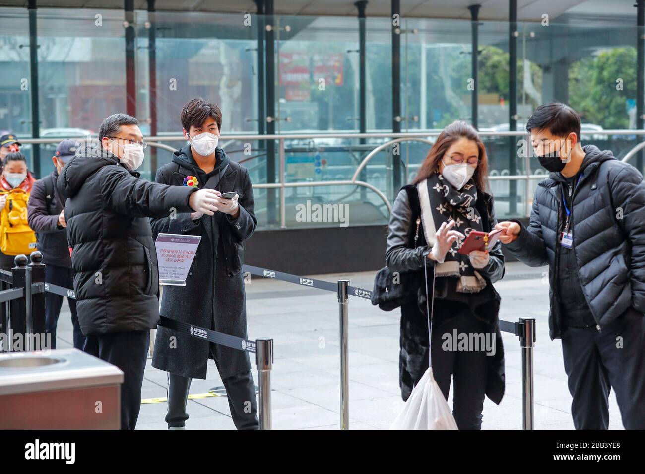 Wuhan, China's Hubei Province. 30th Mar, 2020. Staff memebers help ...