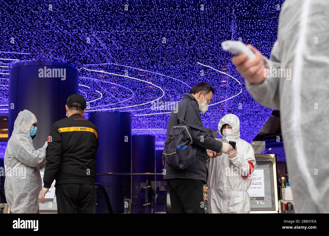 Wuhan, China's Hubei Province. 30th Mar, 2020. Staff members check ...