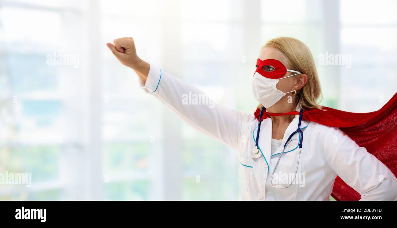 Doctor or nurse wearing surgical face mask in superhero cape. Medical ...
