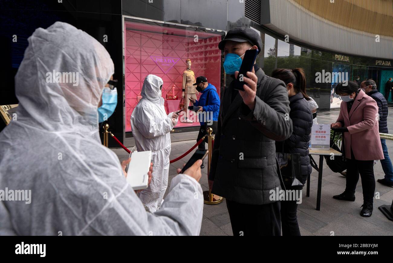Wuhan, China's Hubei Province. 30th Mar, 2020. Staff members check ...