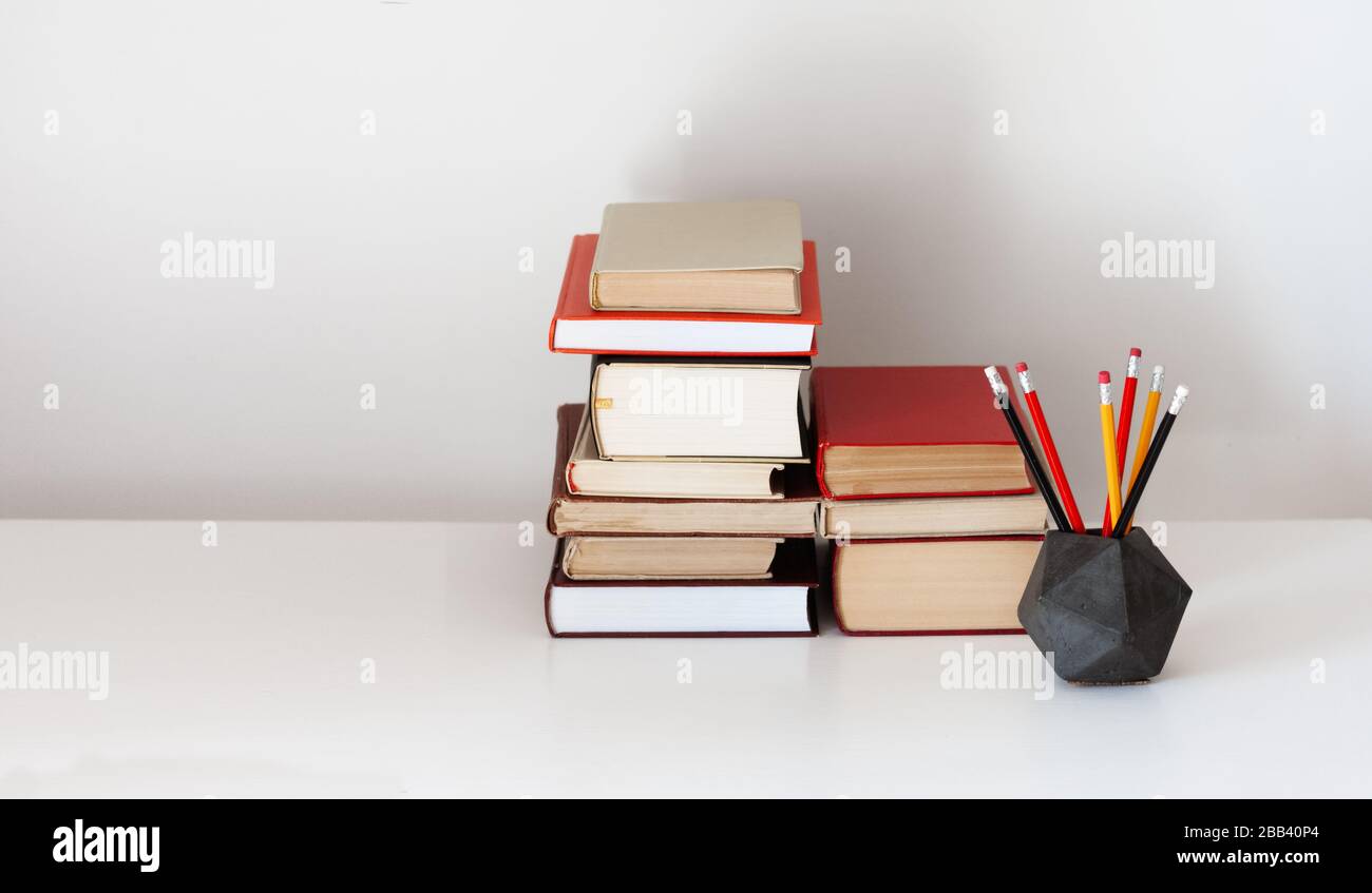 Home office: textbook, notebook, stack of old books retro education ...