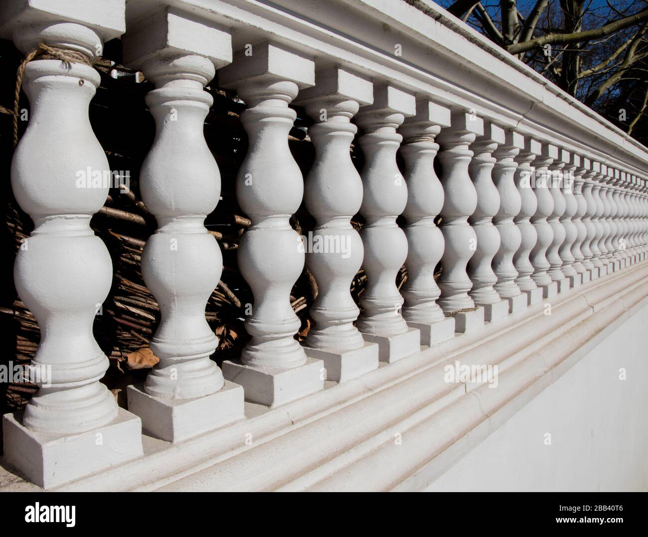 White stone decorative pillars facing a row of houses in South ...