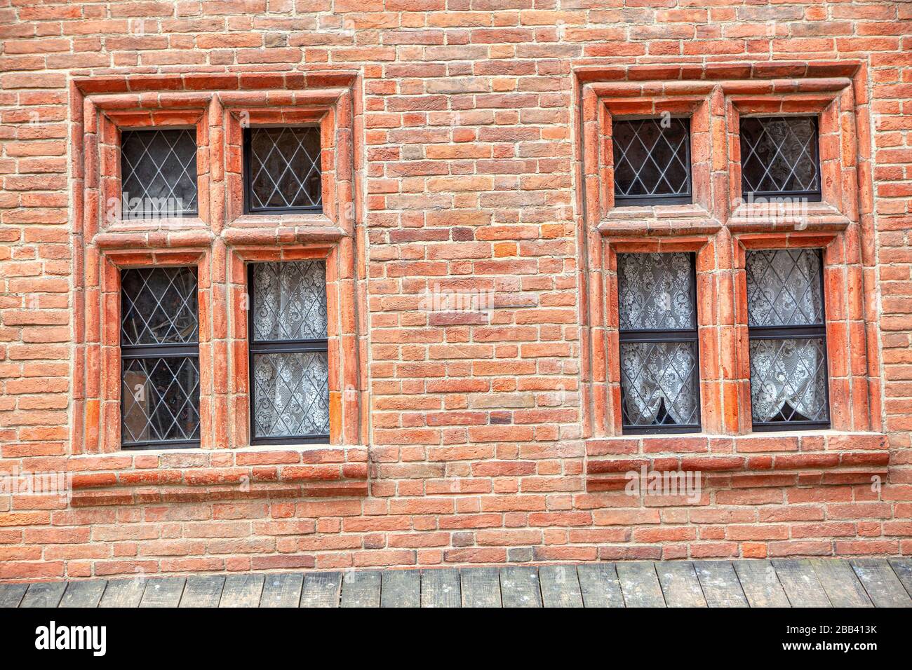 windows and bricks wall of old town Stock Photo - Alamy