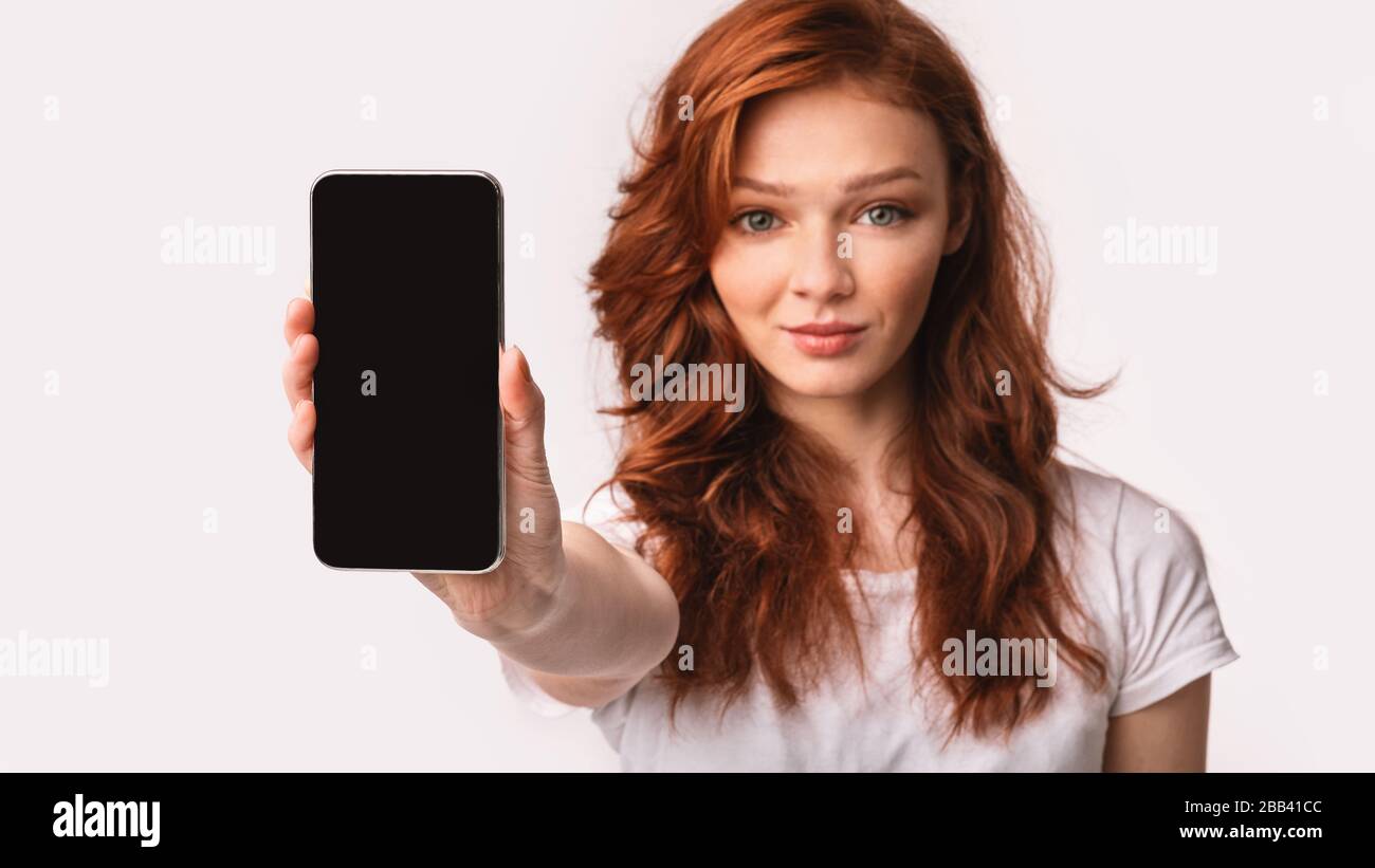 Girl Showing Phone Screen Over White Studio Background, Mockup ...