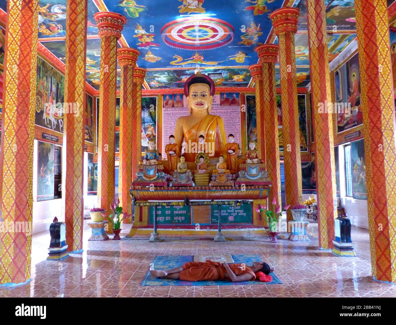 Colorful temple with sleeping monk in Cambodia Stock Photo - Alamy