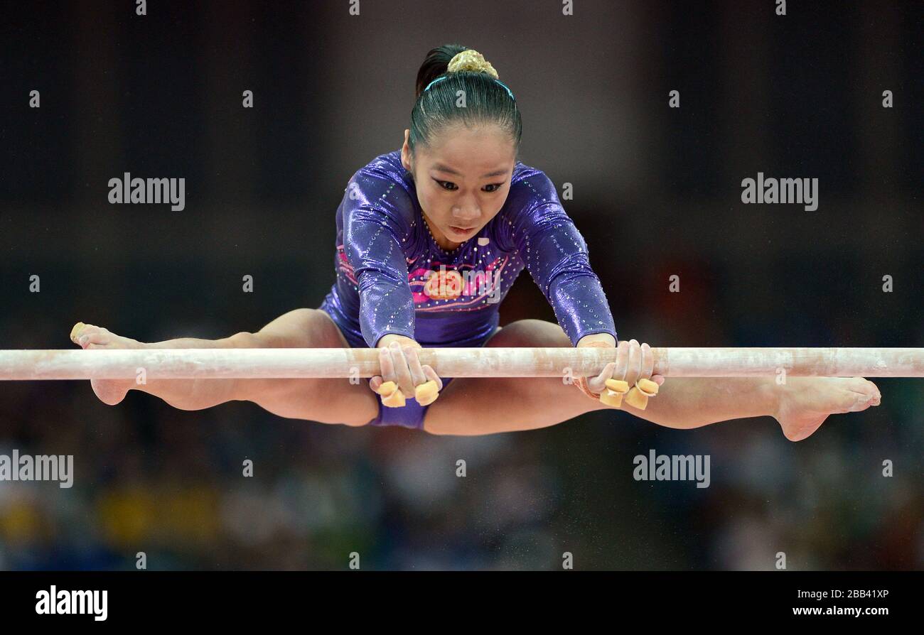 China's Linlin Deng competes on the uneven bars during the Artistic ...