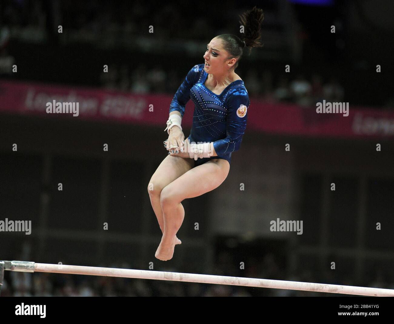 Russia's Aliya Mustafina competes on the uneven bars during the ...