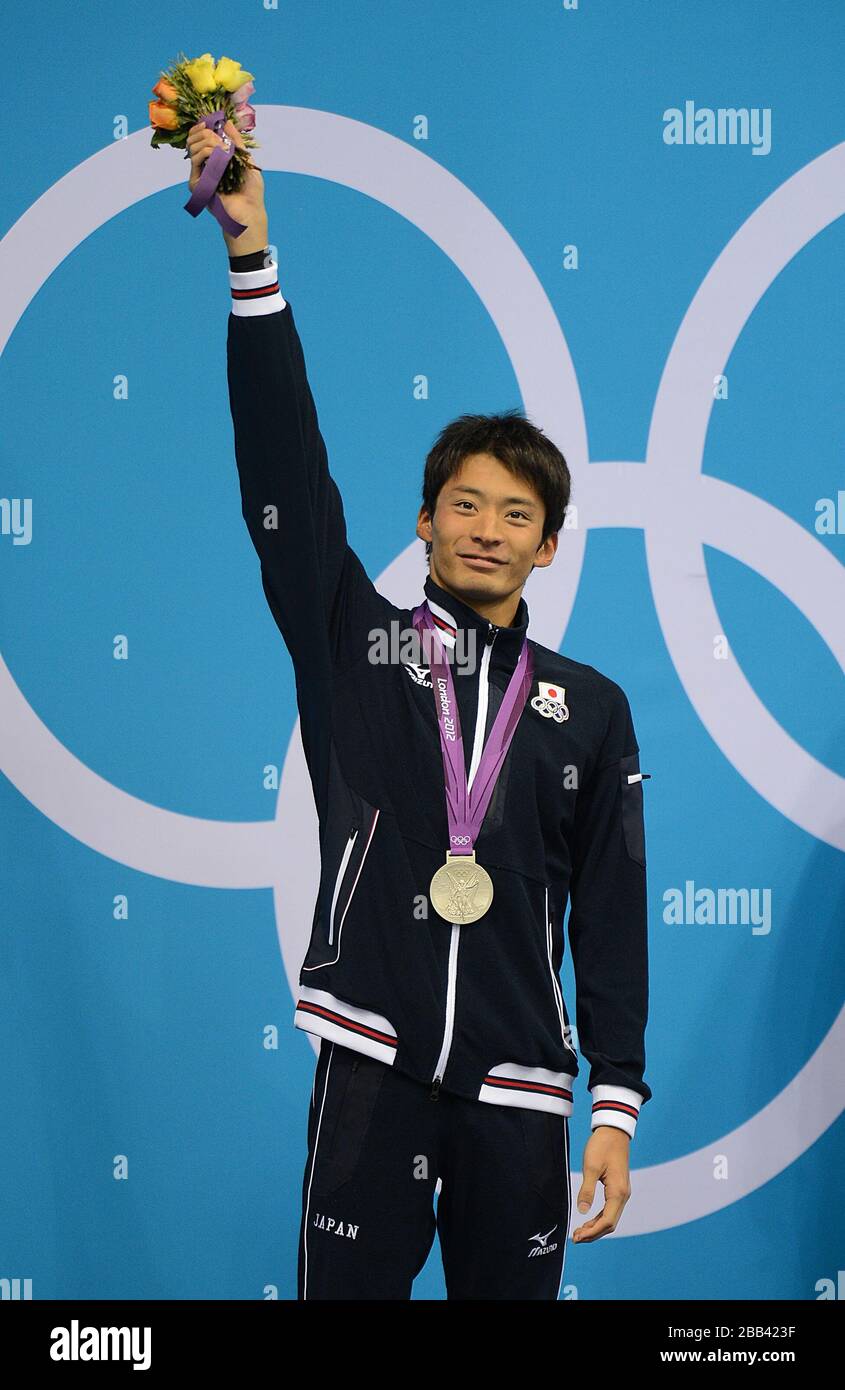 Silver Medalist Ryosuke Irie celebrates with his medal after the Men's ...