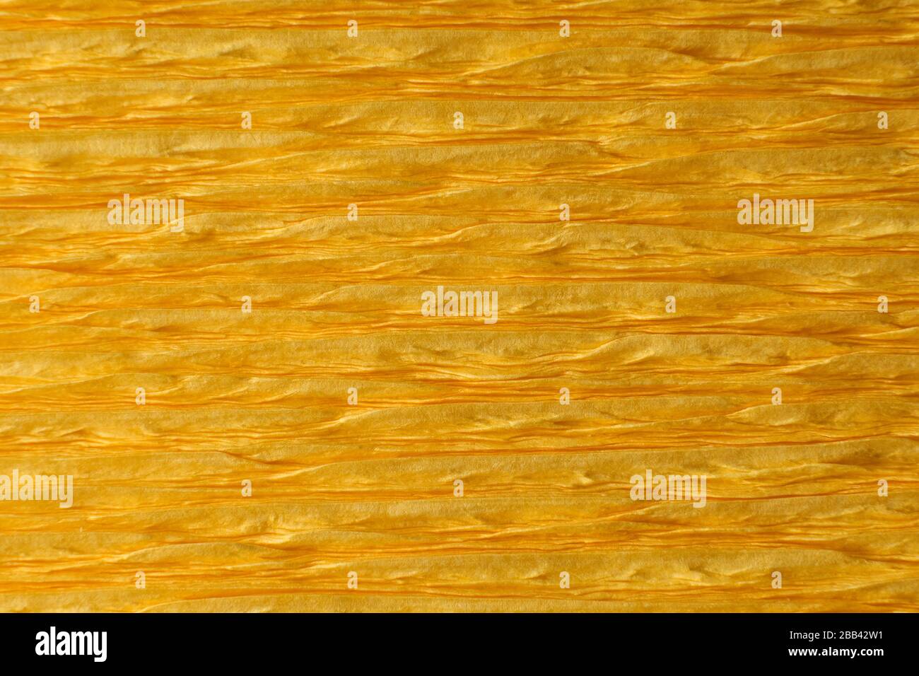 Yellow wrinkled crepe paper close-up detail. Front view Stock Photo - Alamy