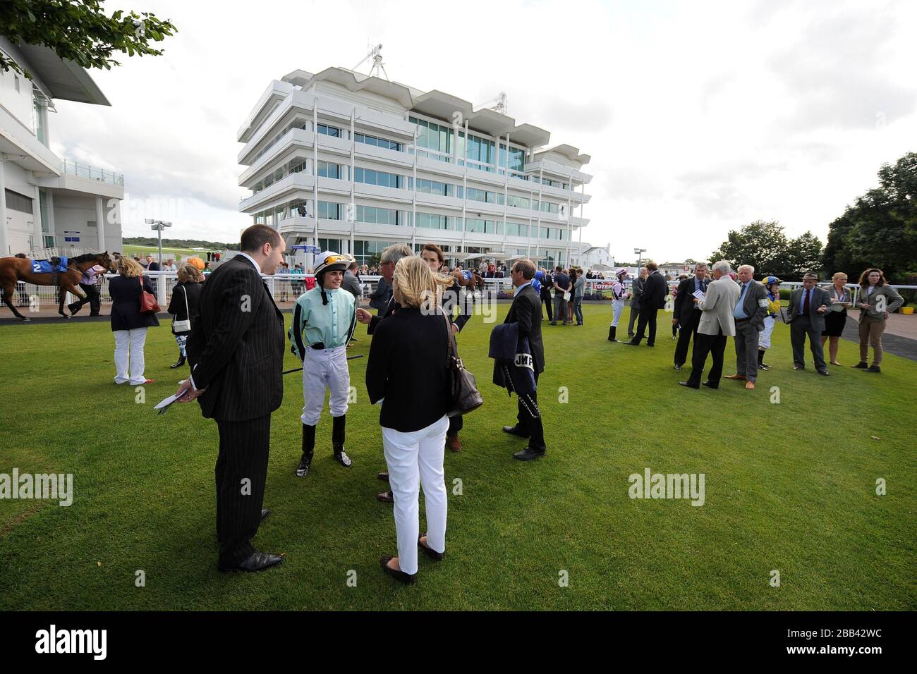 Jockey Ryan Tate speaks with trainer of Baan, James Eustace (centre) in ...