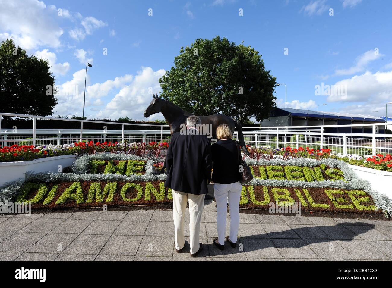 Racegoers admire a statue at Epsom Downs Racecourse commemorating the ...