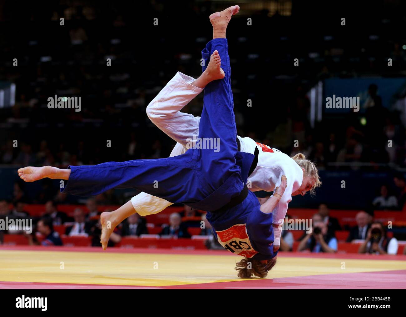 Great Britain's Sarah Clark (bottom) is thrown by France's Automne ...