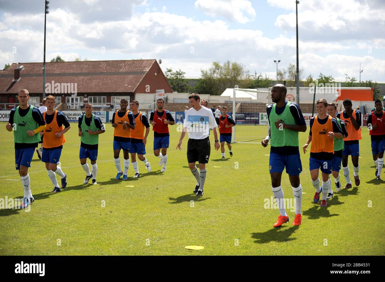 Coventry City assistant physiotherapist Sam Heathcote (centre) oversees ...
