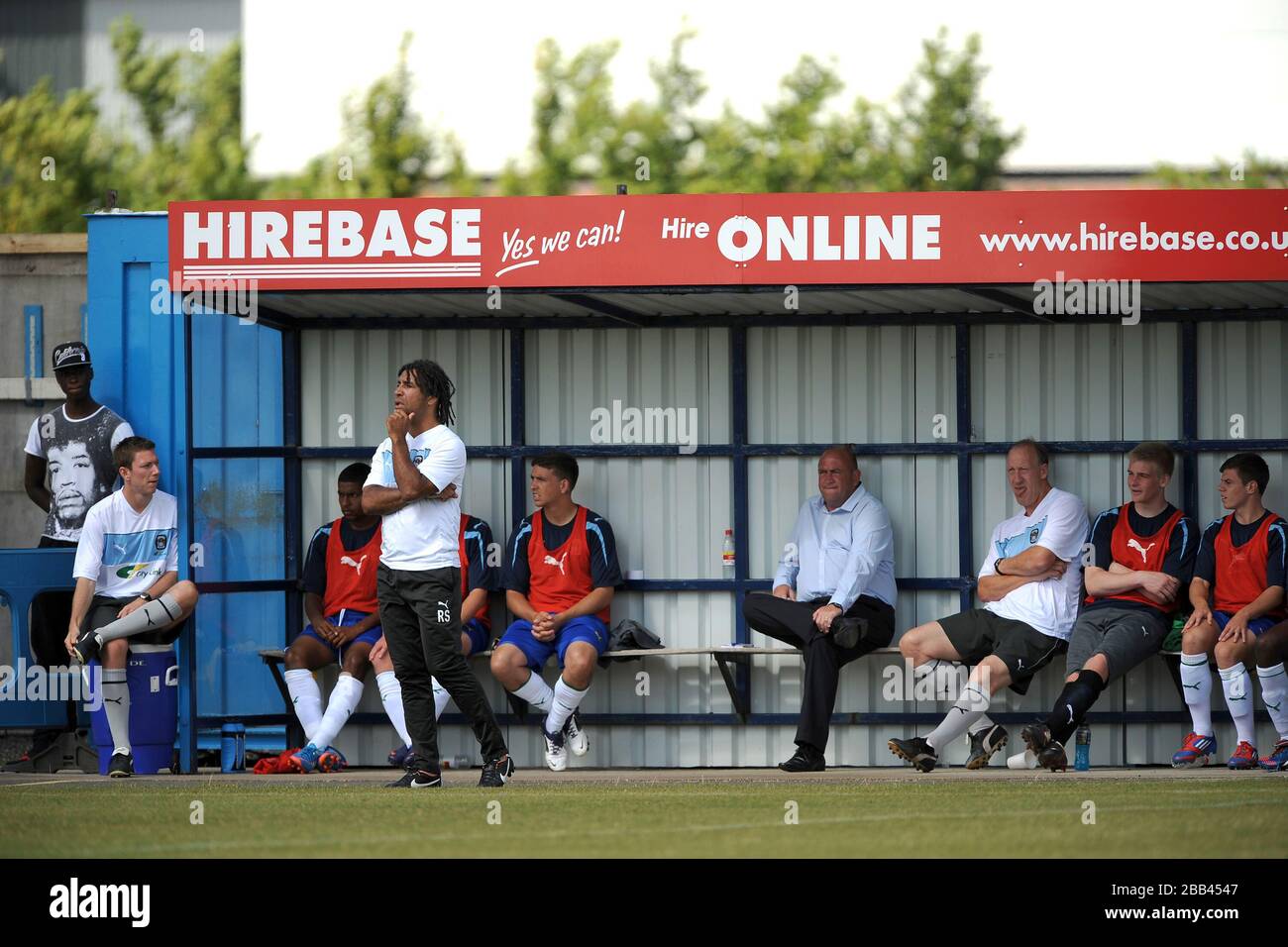Coventry City coach Richard Shaw (third left) looks on from the ...