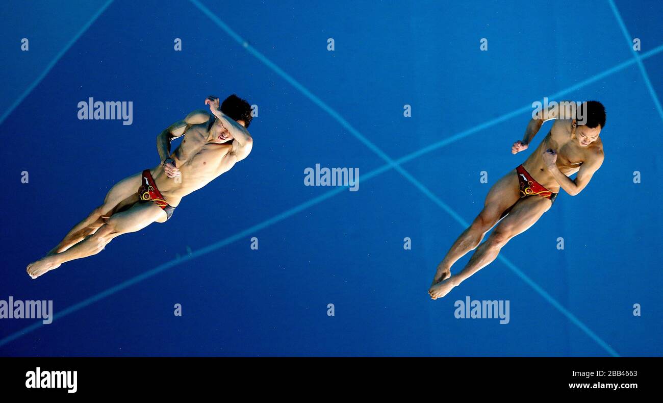 Kai Qin and Yutong Luo of China compete in the Men's Synchronised 3m ...