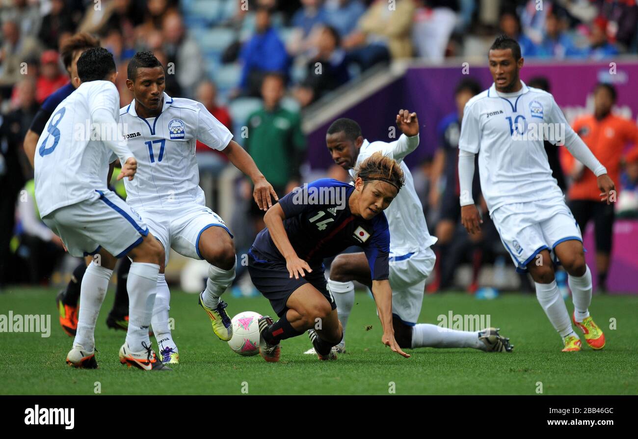 Japan's Takashi Usami (centre) is stopped by Honduras' Alfredo Mejia ...