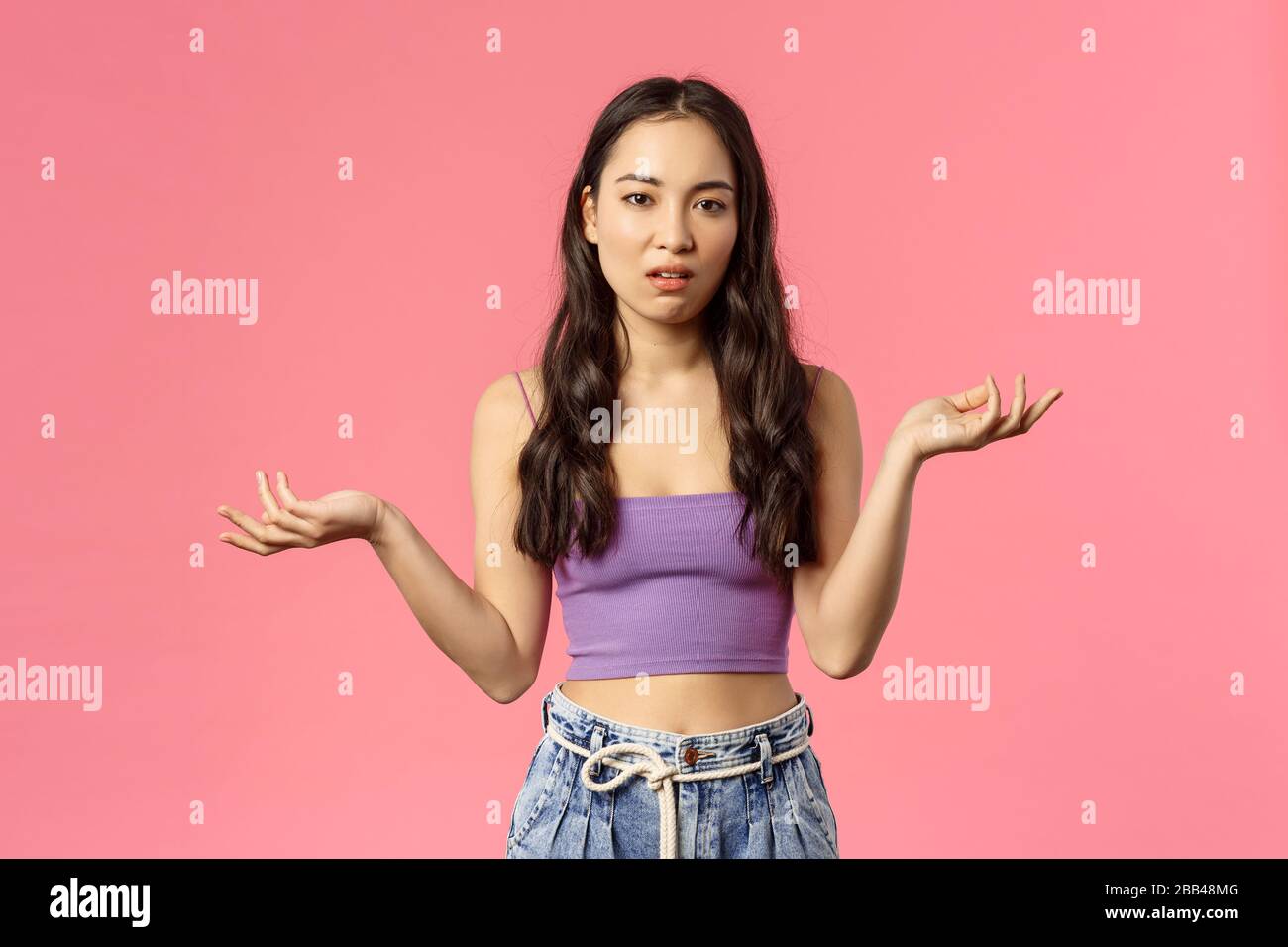 So what. Portrait of careless arrogant stylish asian girl shrugging ...